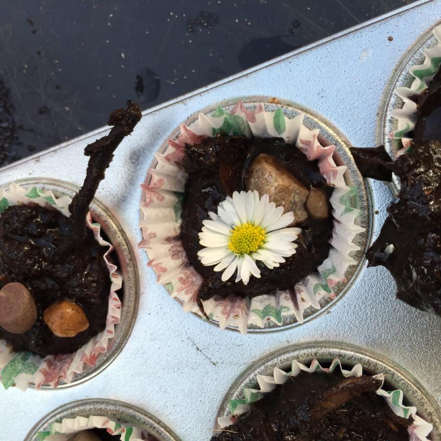 Making mud cakes in our mud kitchen - the-gingerbread-house.co.uk